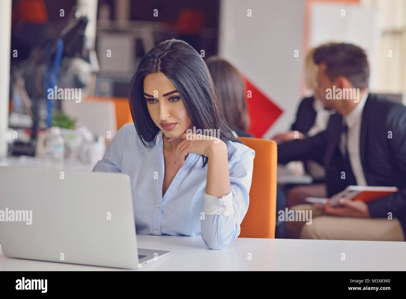 Woman working at computer in an office Stock Photo - Alamy