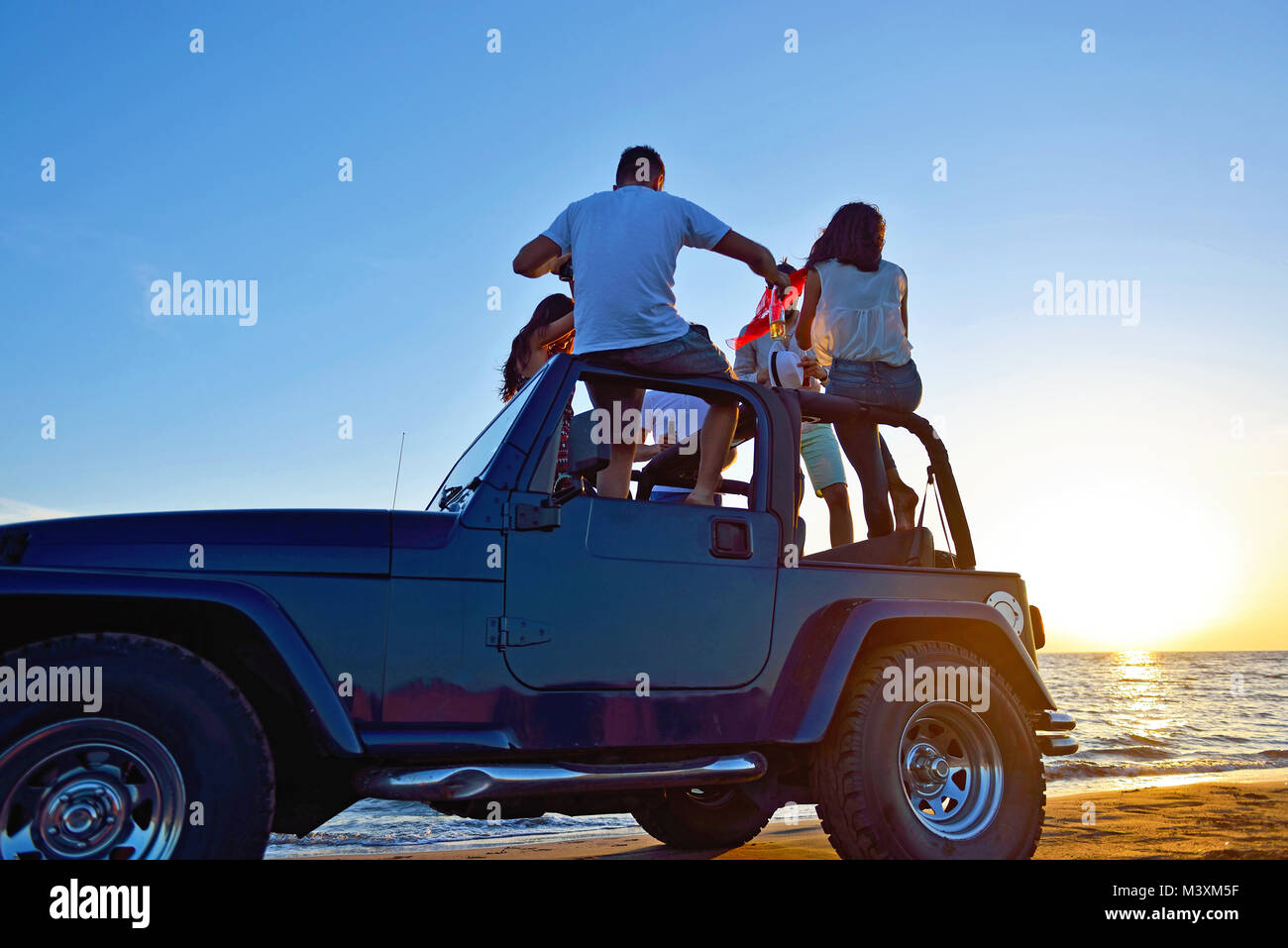 Group of happy friends making party in car - Young people having fun ...