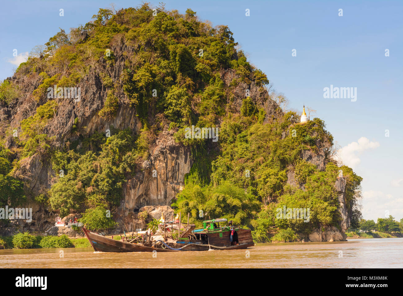 Hpa-An: hill of bat cave, Thanlwin (Salween) River. River dredge boat ...