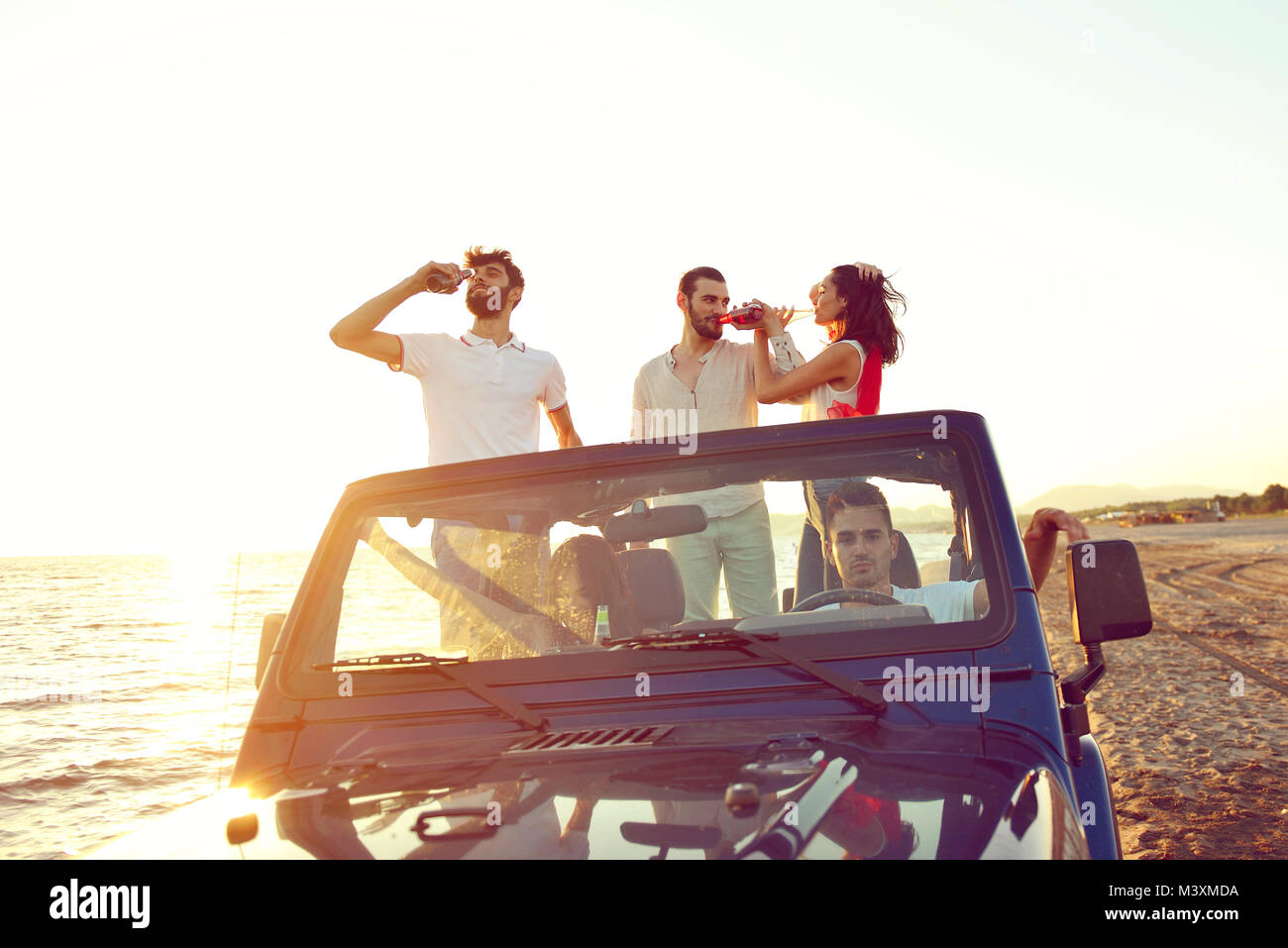 Group of happy friends making party in car - Young people having fun ...