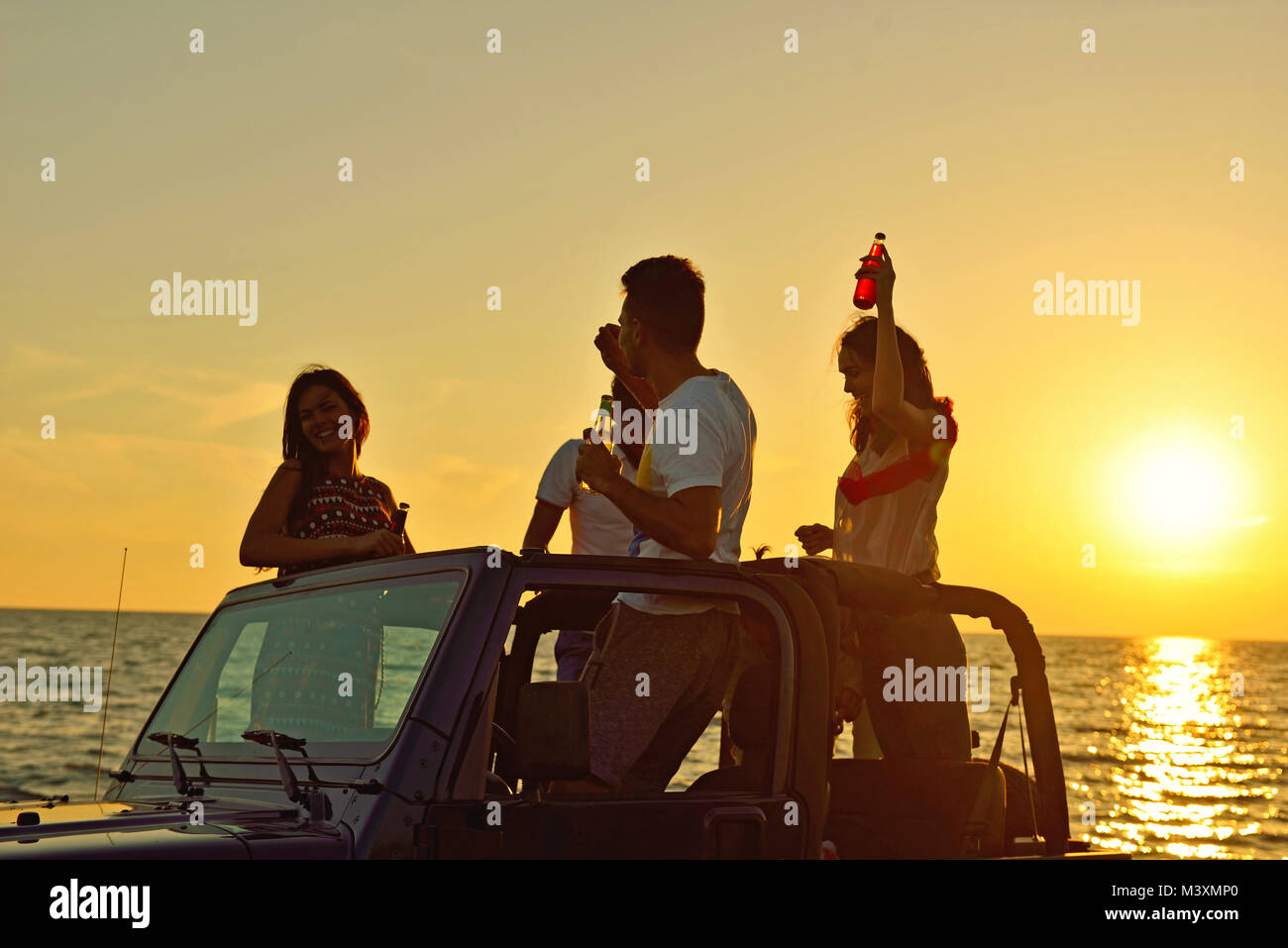 Group of happy friends making party in car - Young people having fun ...