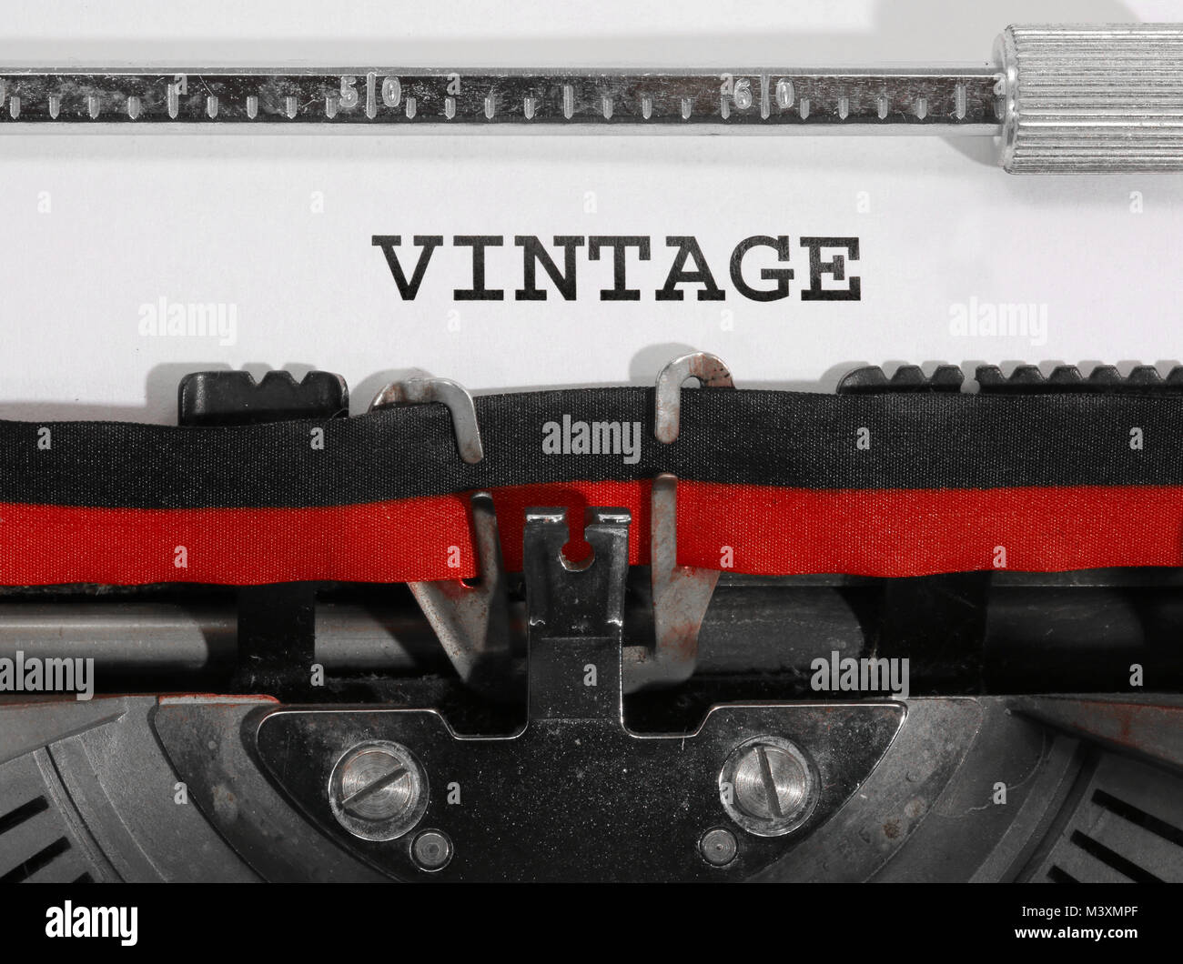 very big Text VINTAGE written with the old typewriter on white page ...