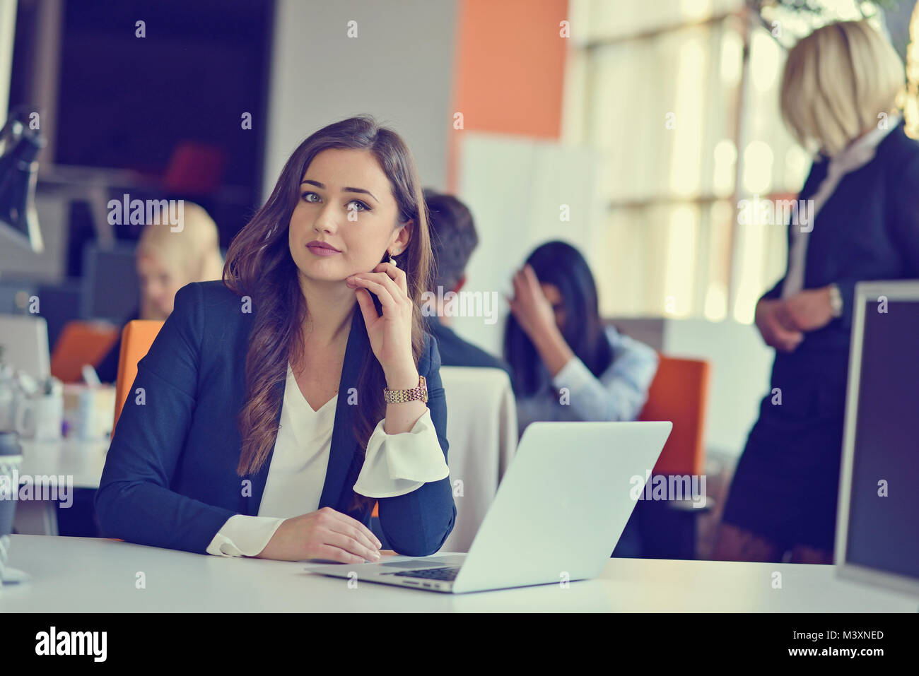 Woman working at computer in an office Stock Photo - Alamy