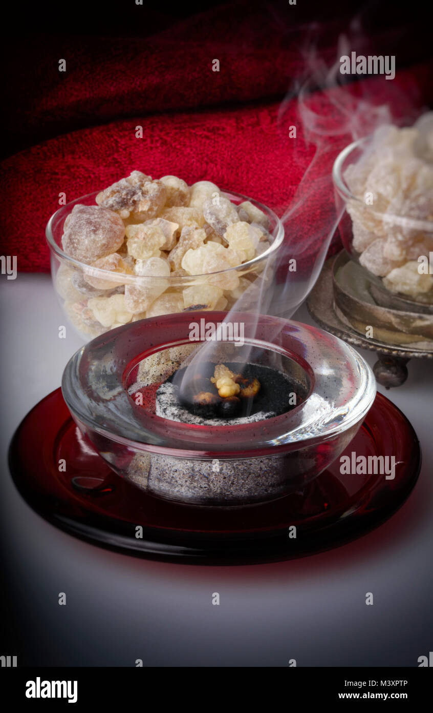 Frankincense burning on a hot coal. Frankincense is an aromatic resin ...