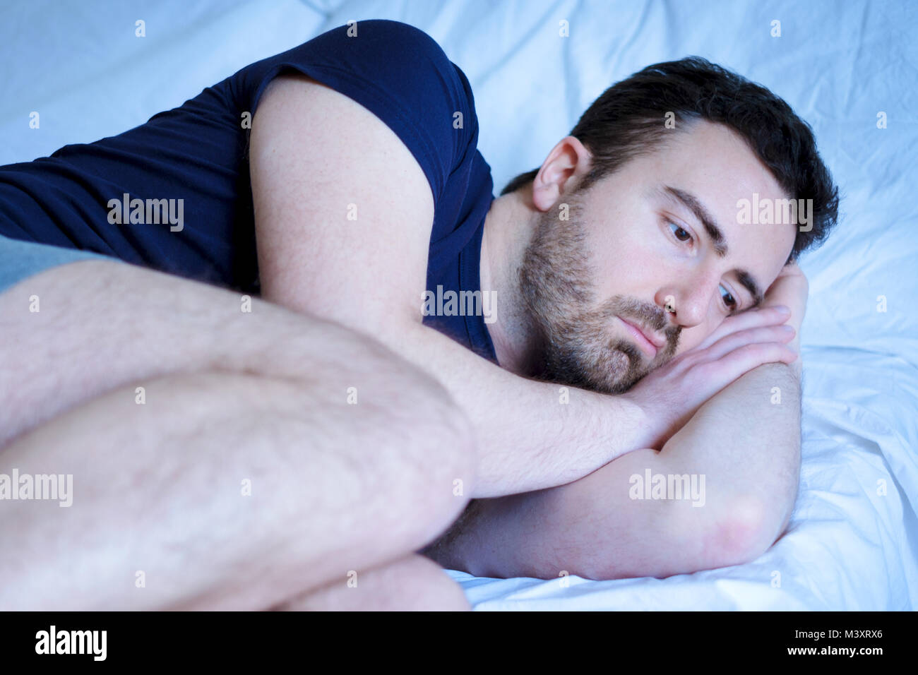 Sad man bed hi-res stock photography and images - Alamy