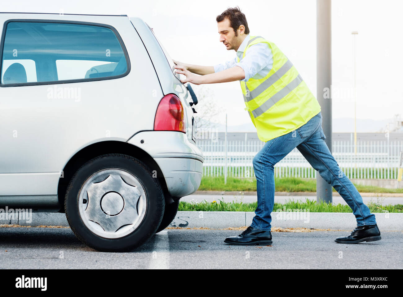 Stressed man pushing his car after engine breakdown Stock Photo - Alamy Stressed man pushing his car after engine breakdown Stock Photo - Alamy
