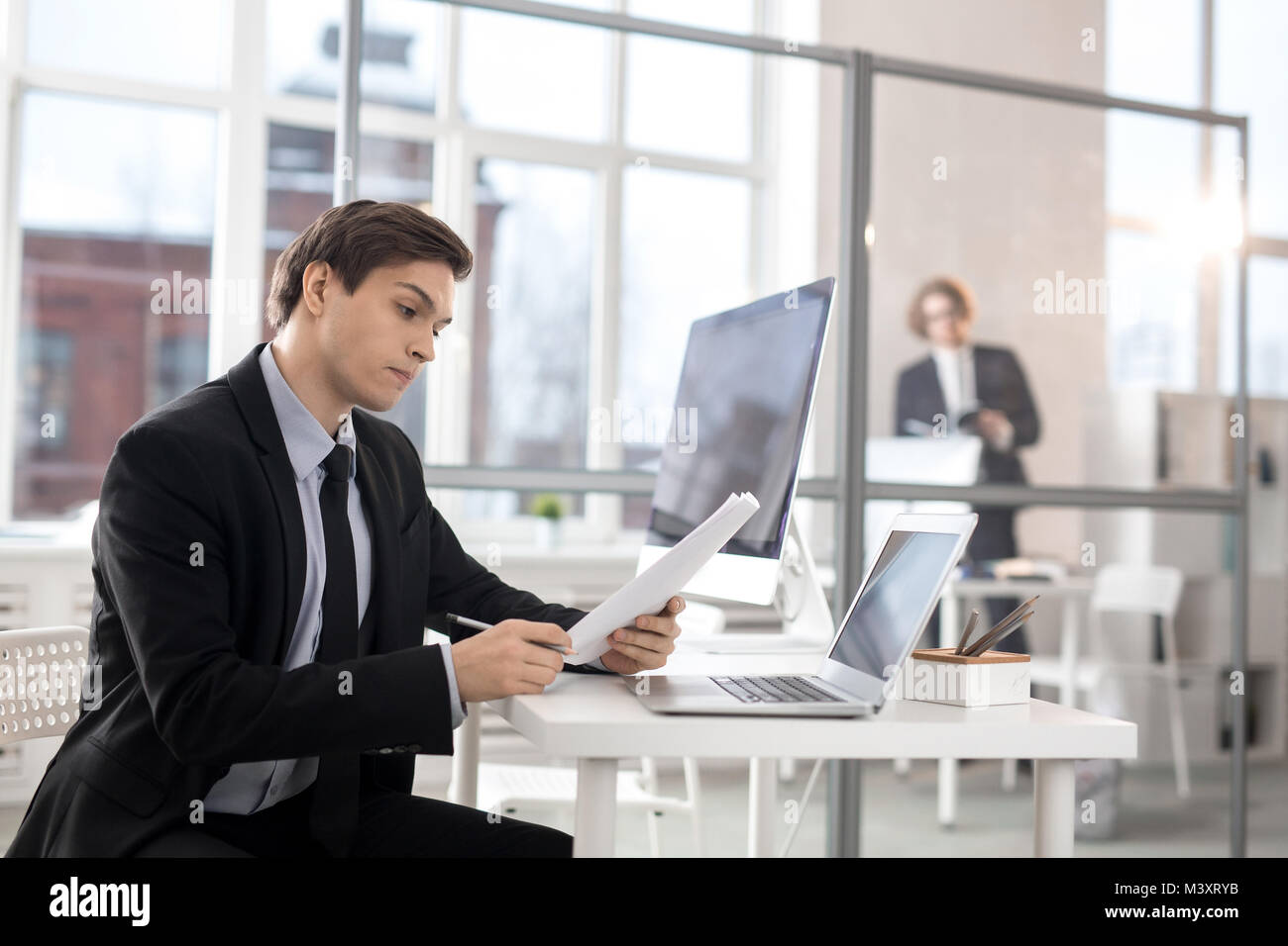 Adult man reading documents hi-res stock photography and images - Alamy
