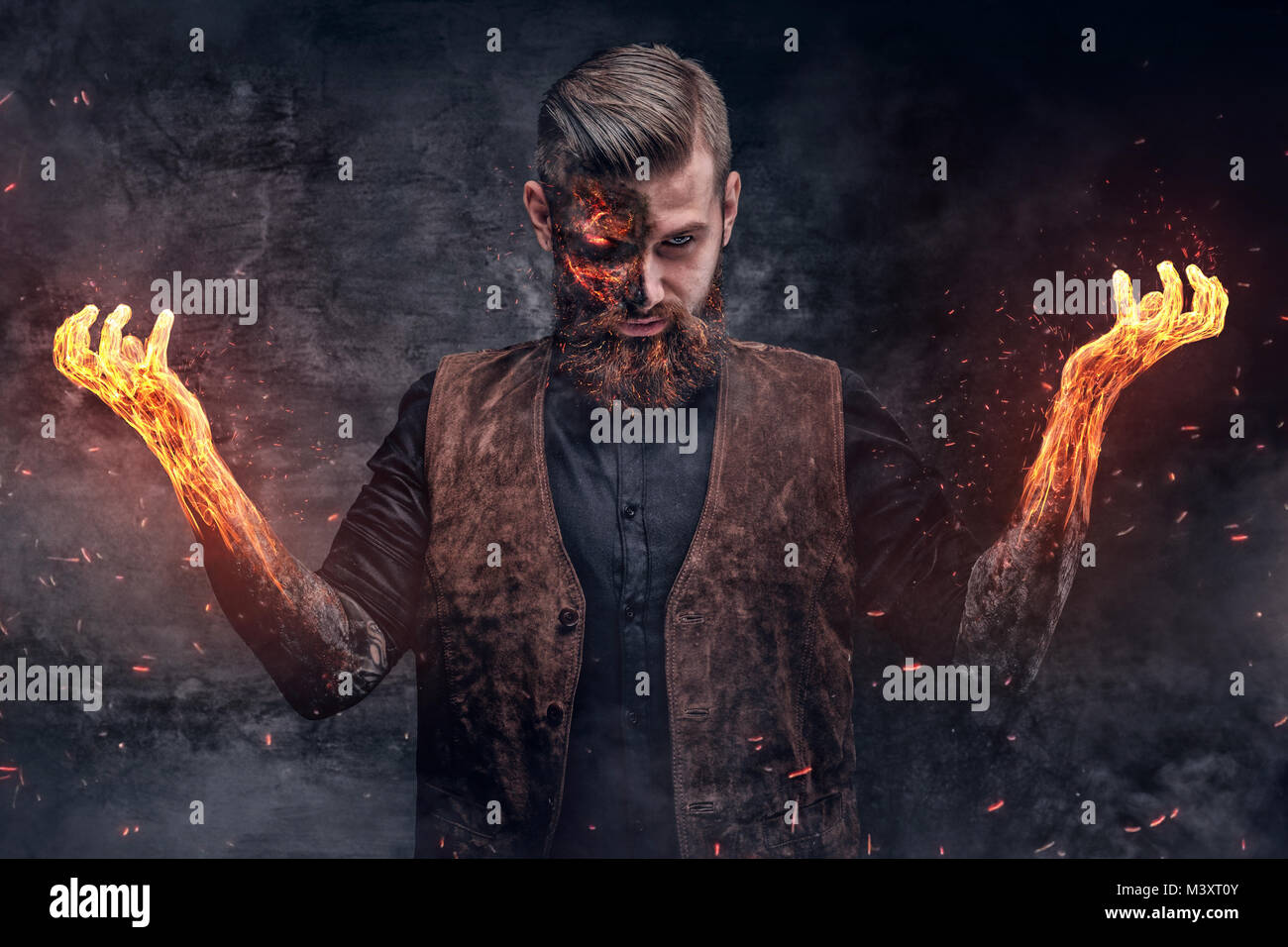 Scary burning man with arms in a fire Stock Photo - Alamy