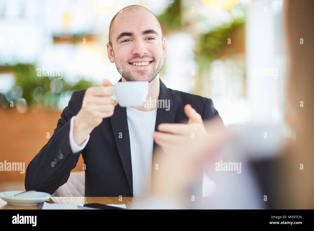 Talk at coffee-break Stock Photo - Alamy