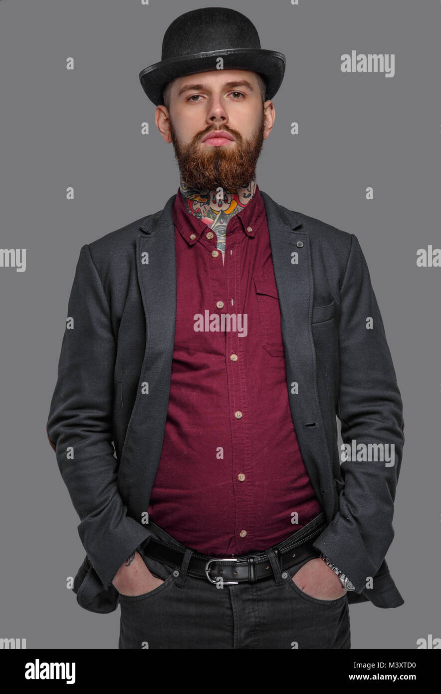 Portrait of tattooed hipster isolated on grey background Stock Photo ...