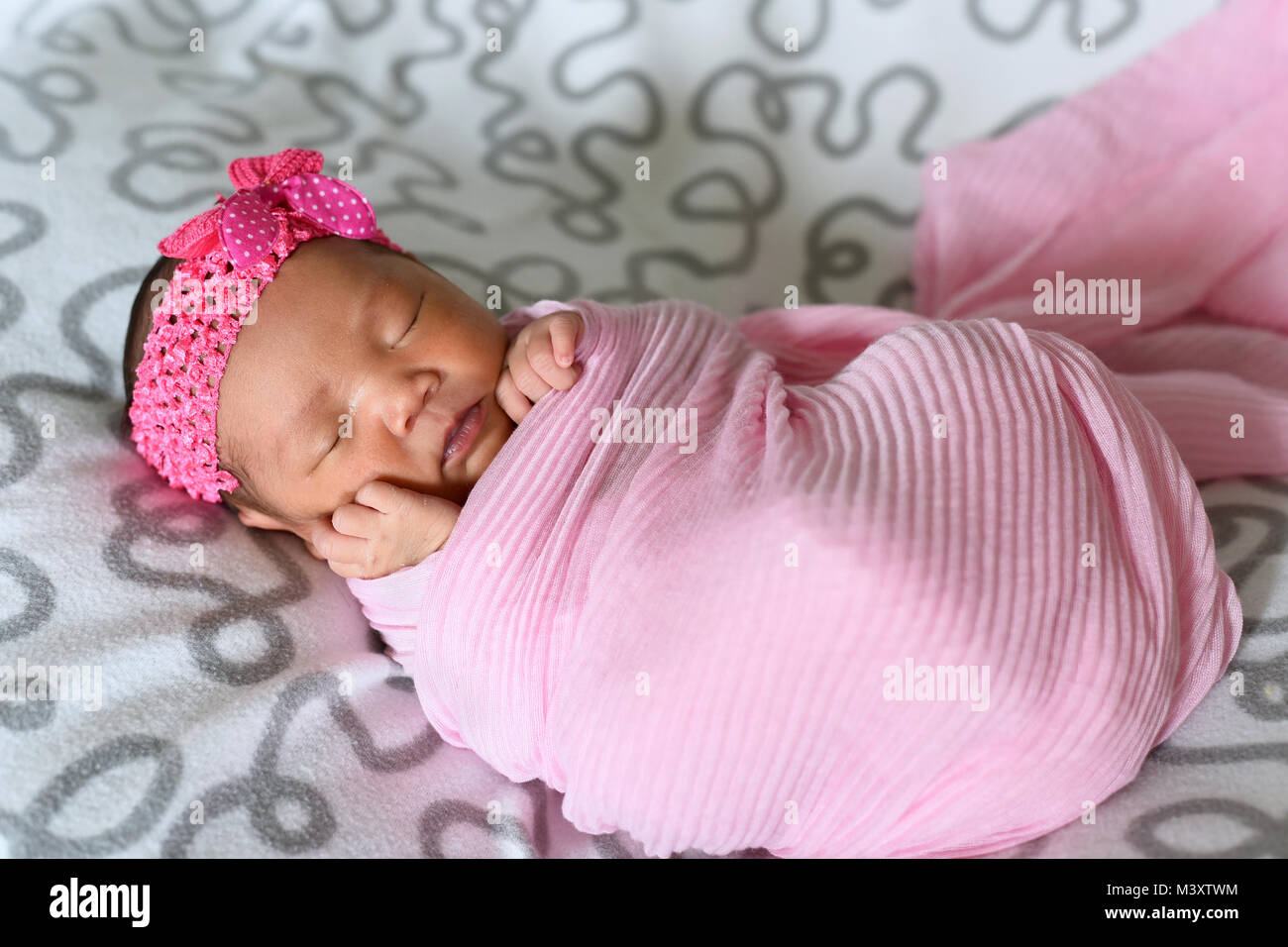 Newborn baby wrapped in cloth hi-res stock photography and images - Alamy