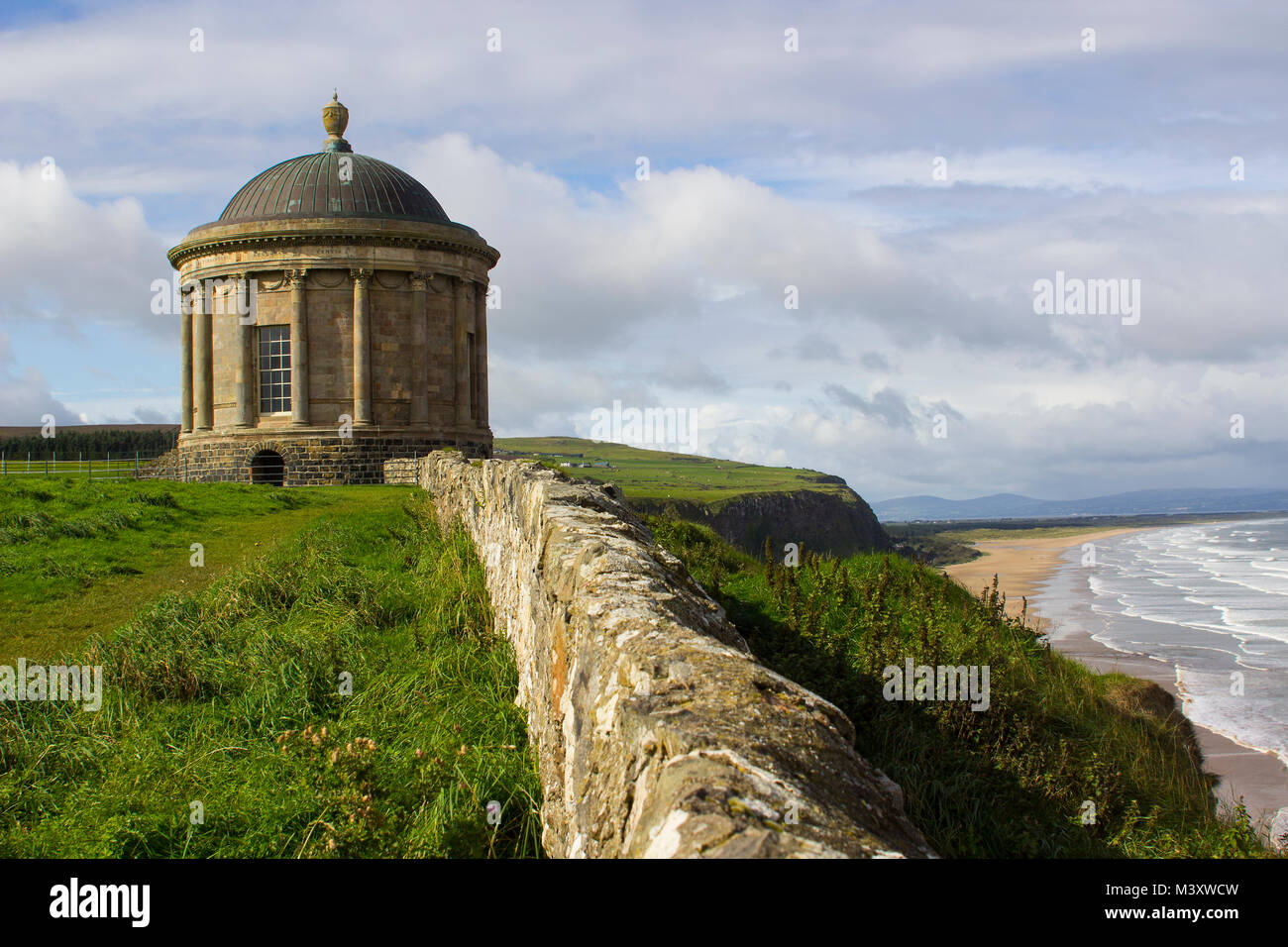The ancient Mussenden Temple Monument on the clifftop edge overlooking ...