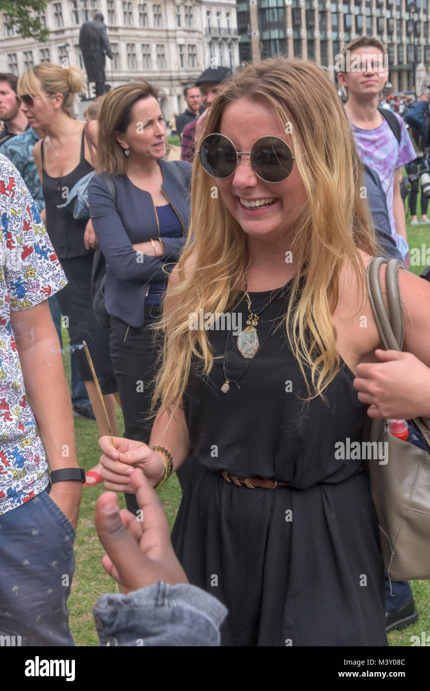 A Woman Burns Incense Sticks After The Mass Inhalation Of Nitrous Oxide Laughing Gas In