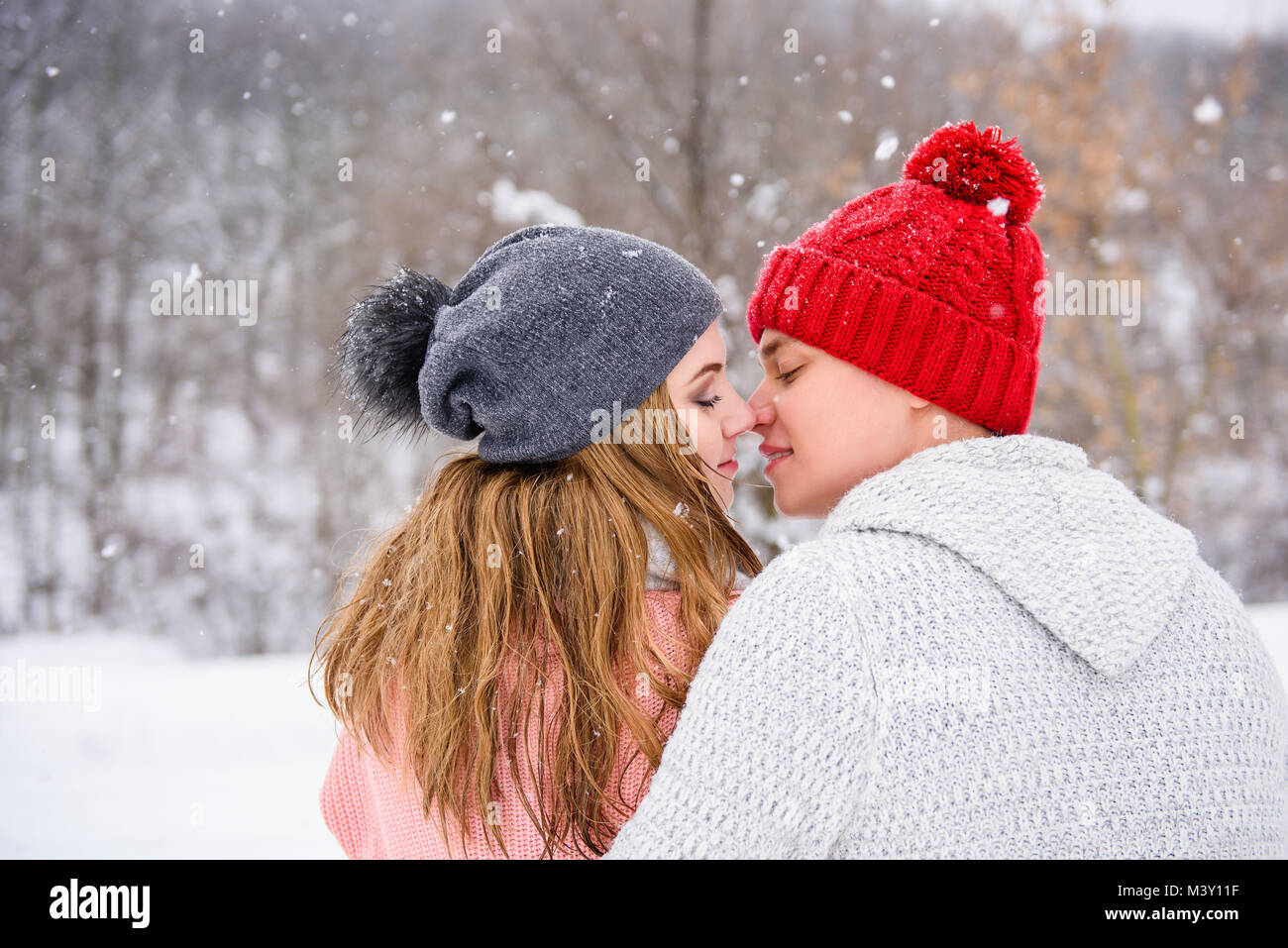 Girl kissing woman back view hi-res stock photography and images - Alamy