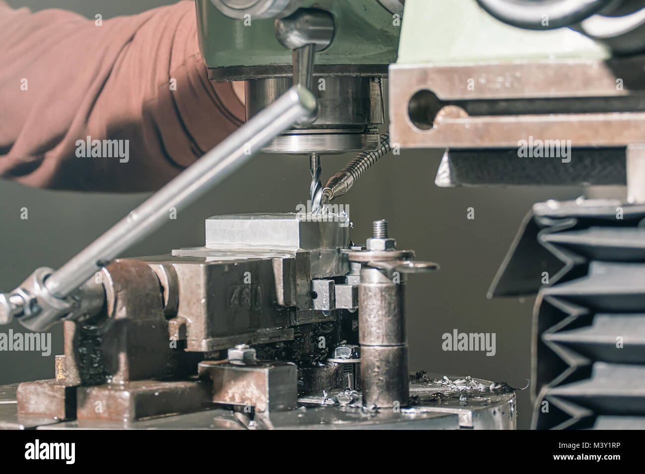 Employee drilling. Metal drilling. Metal workshop Stock Photo - Alamy