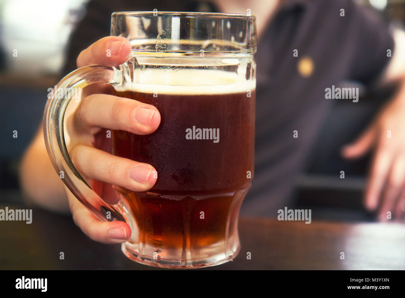 Beer in each hand hi-res stock photography and images - Alamy
