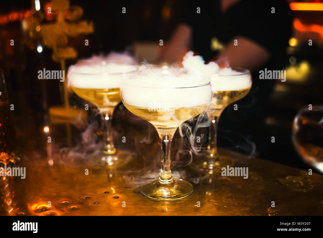 Cocktails with smoke in the nightclub Stock Photo - Alamy