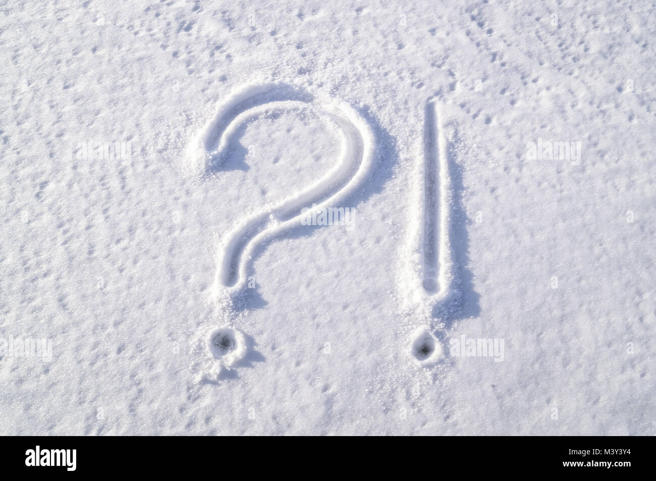 Question mark and exclamation mark on white snow. Question. Exclamation ...