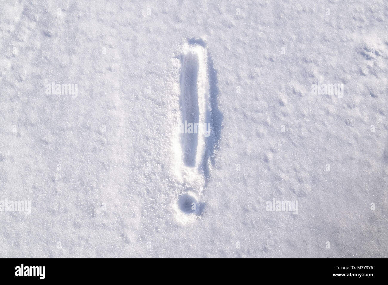 Exclamation mark on white snow. Exclamation. Painted on solid snow ...