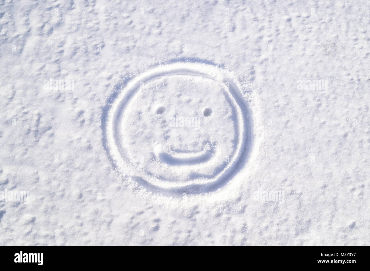 Smile emoji in snow hi-res stock photography and images - Alamy
