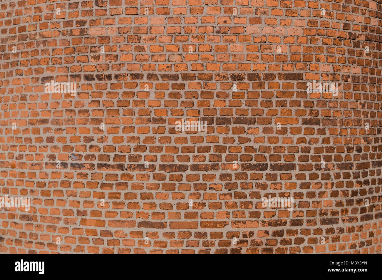 Ancient brick wall of a round temple in Asia. Old red brick wall ...