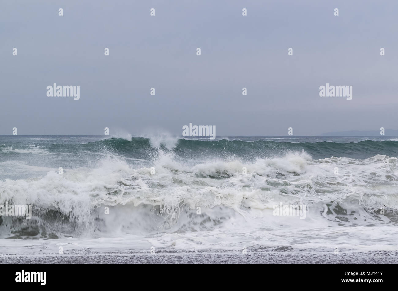 Big waves crash on beach hi-res stock photography and images - Alamy