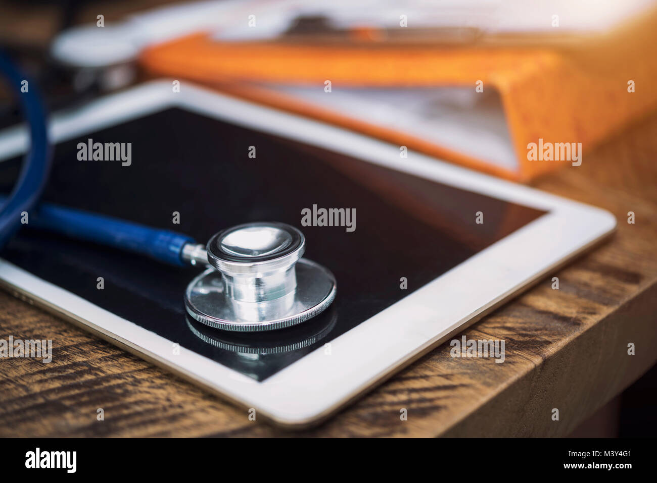 Healthy checking concept. Doctors wood desk with tablet computer ...