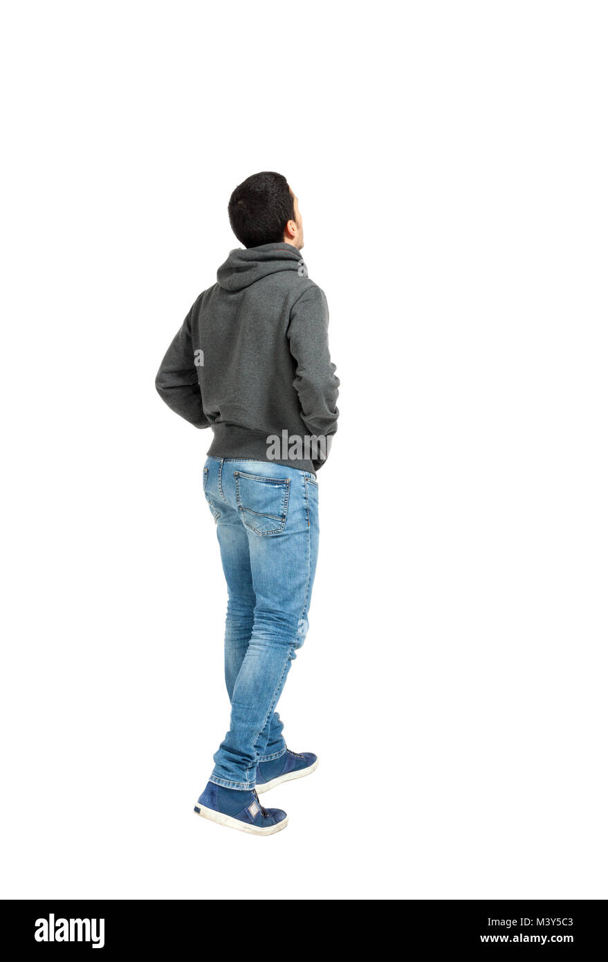 Portrait of the young man isolated on a white background, back view ...