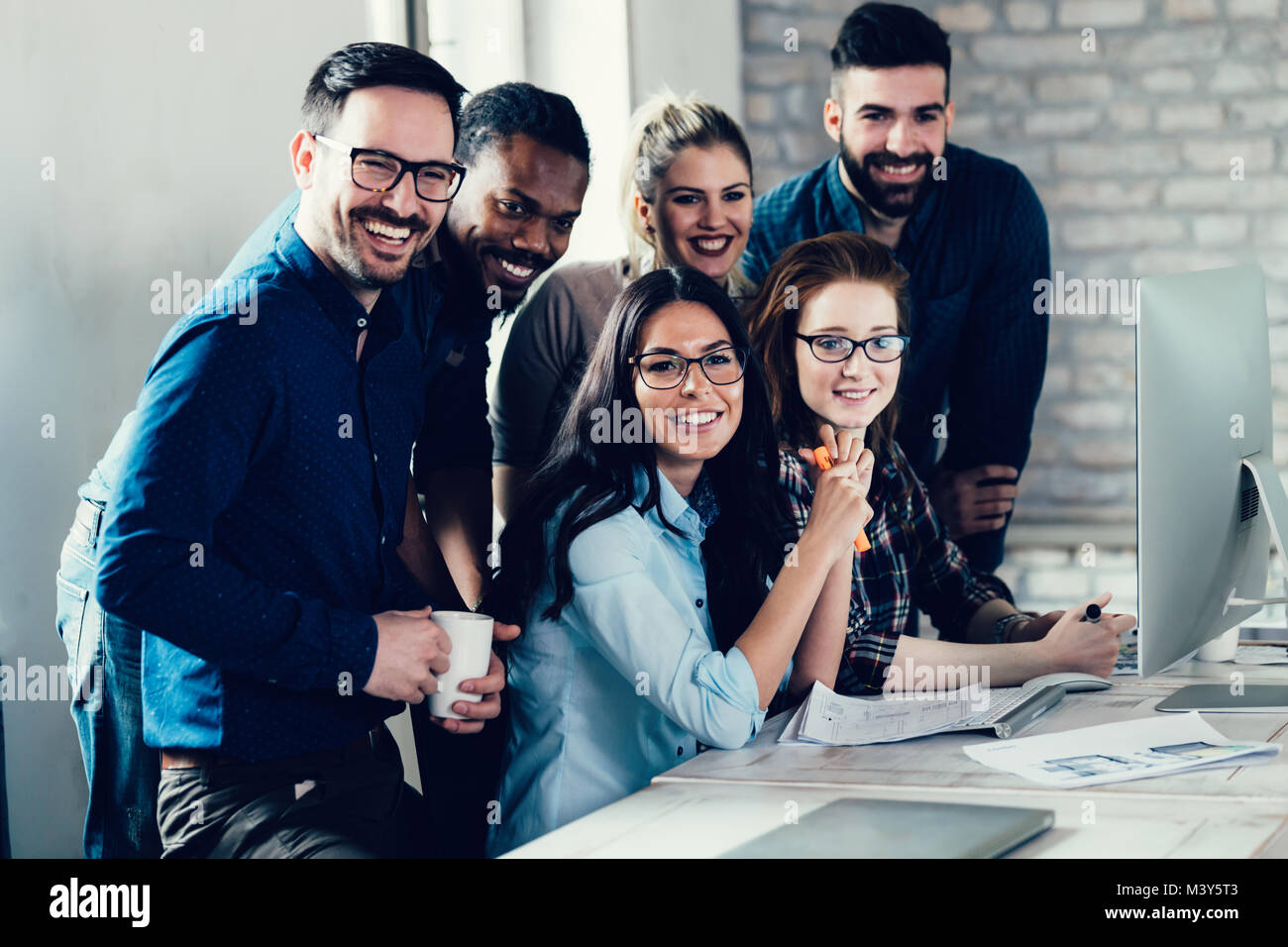 Picture of architects working together in office Stock Photo - Alamy
