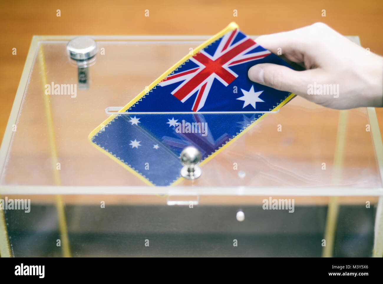Man inserting Flag of Australia into ballot box, voting and elections ...
