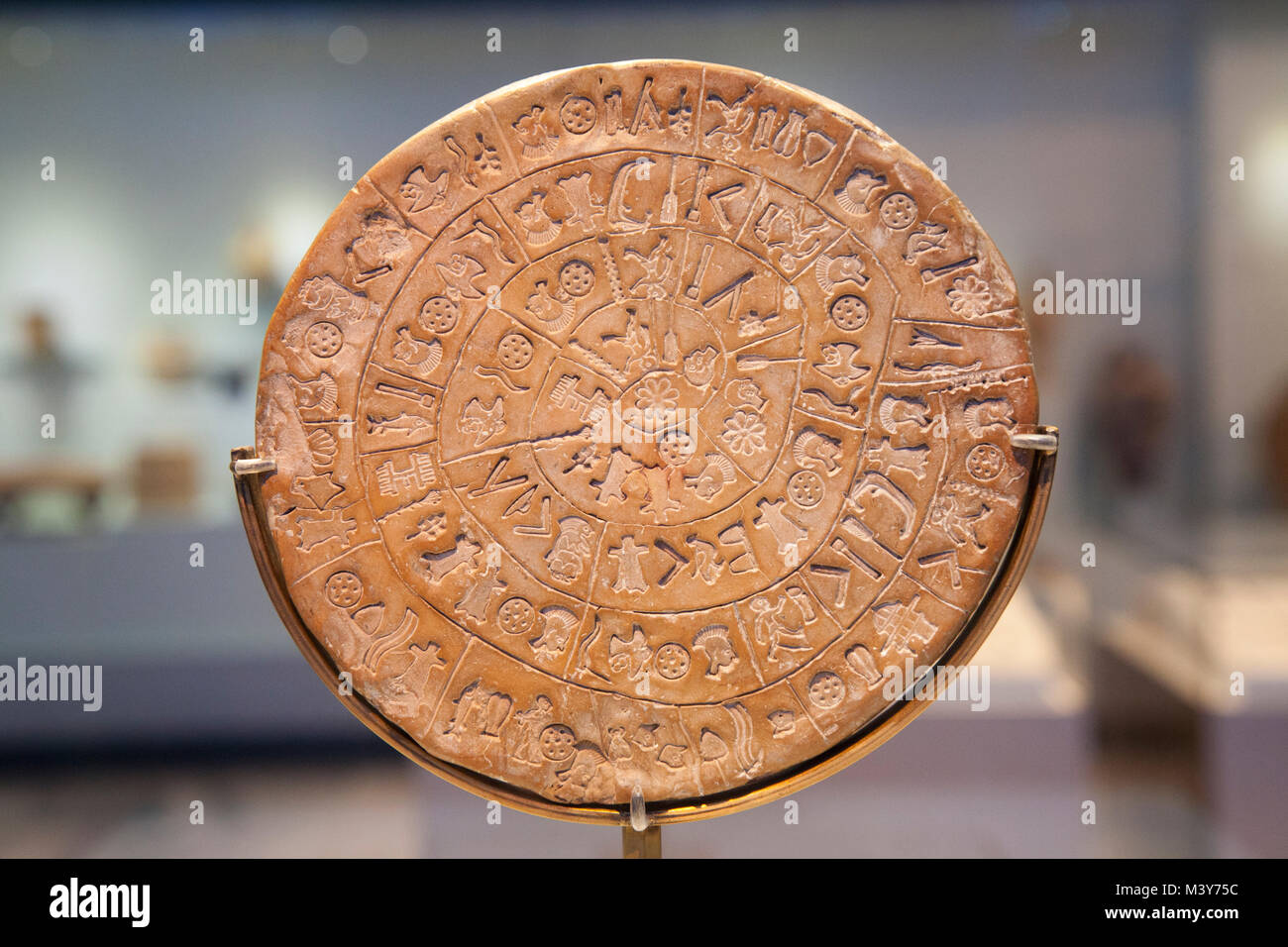 The Phaistos Disc dated early 17th century BC, Archaeological Museum of ...