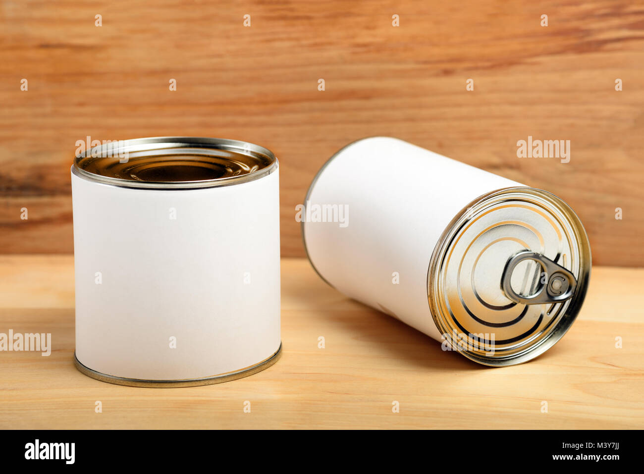 food tin cans on wood background Stock Photo - Alamy