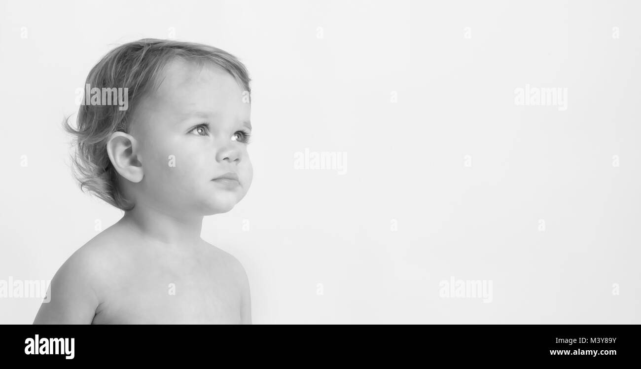 Baby boy look in light Stock Photo - Alamy