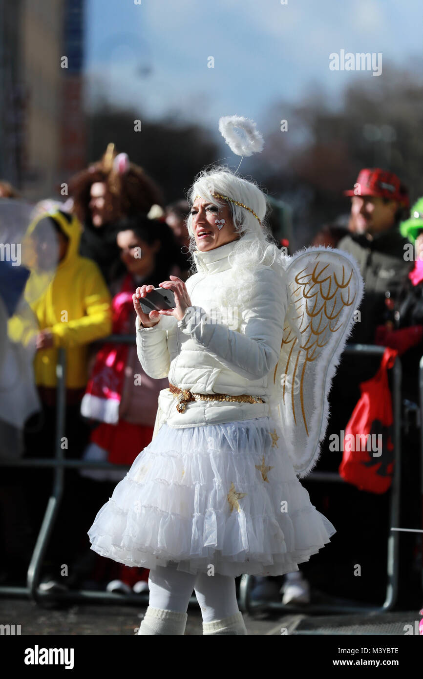 Cologne, Germany. 12th Feb, 2018. A reveler attends the Rose Monday ...