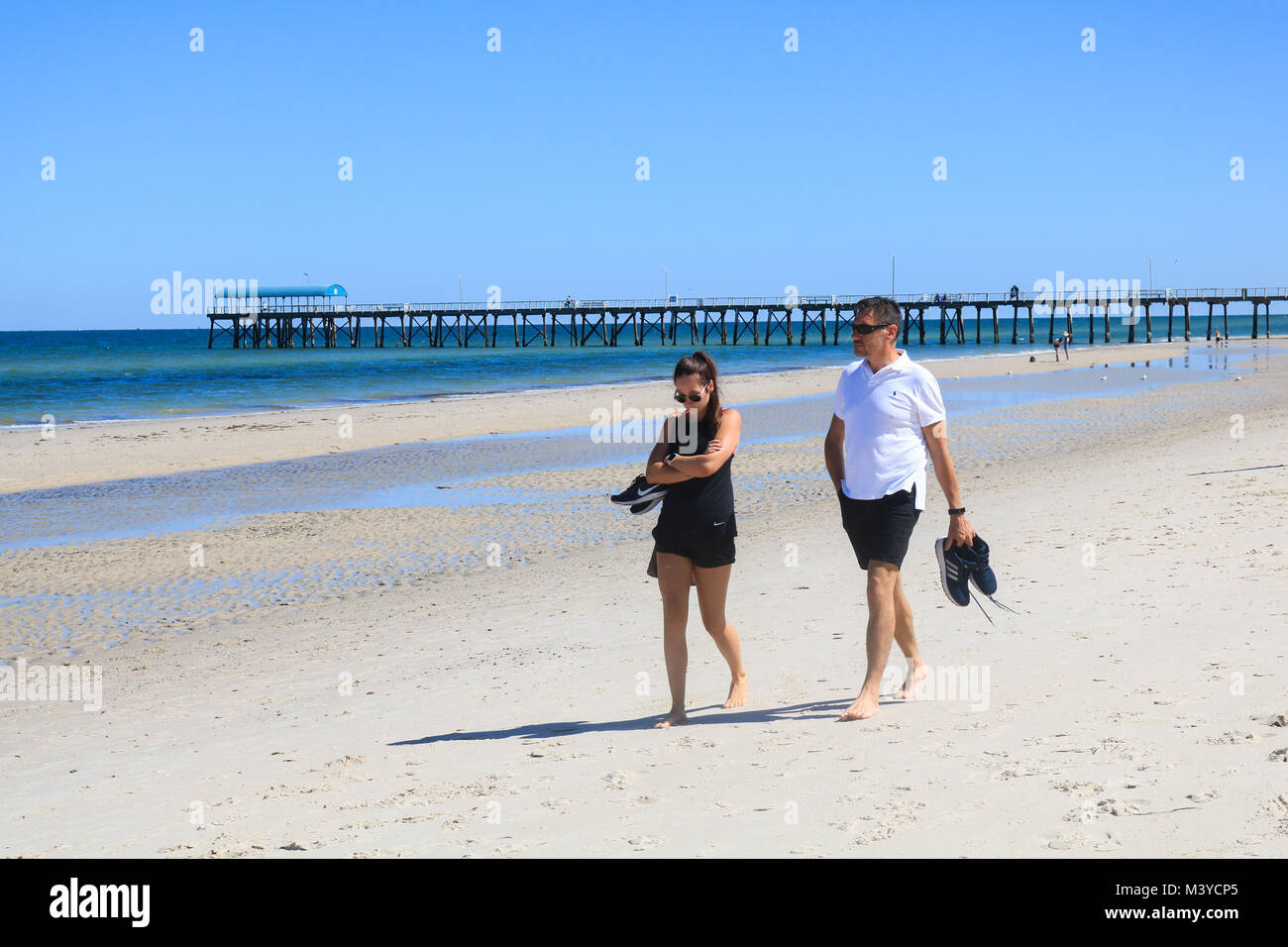 Adelaide, Australia. 13th Feb 2018.A couple stroll along the Grange ...
