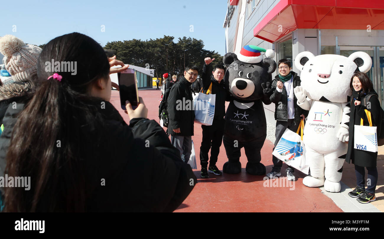 13th Feb, 2018. Taking a photo with Olympic mascots Visitors take a ...