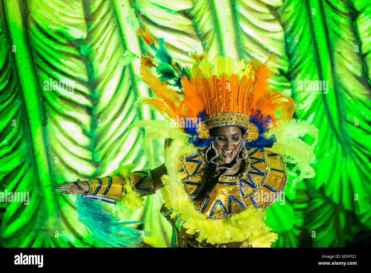 Rio De Janeiro, Brazil. 13th Feb, 2018. A reveler performs on a float ...