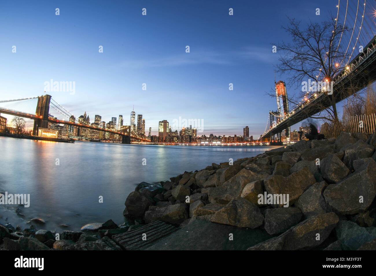 View of Manhattan Island from Brooklyn in New York City on the evening ...