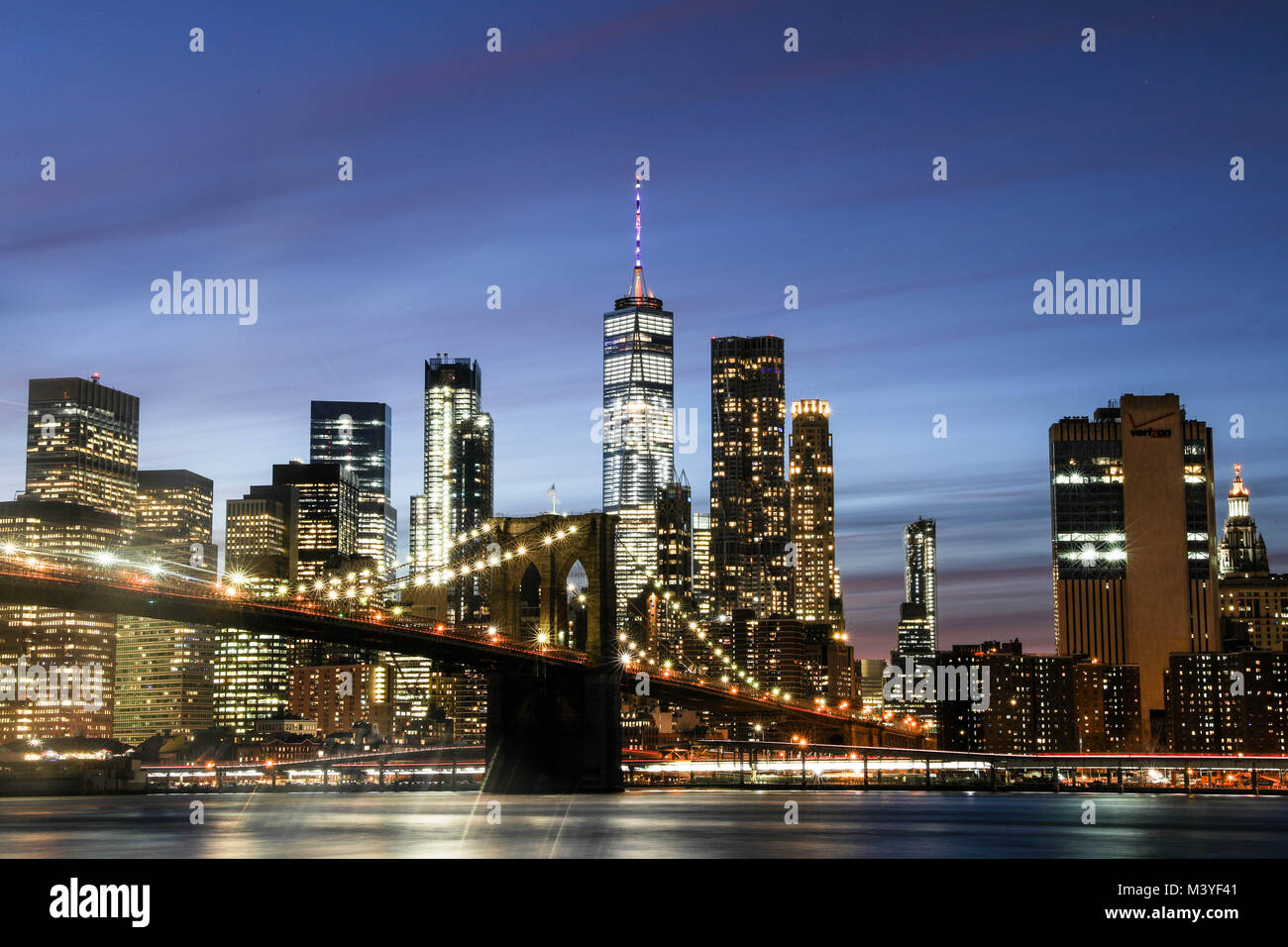 View of Manhattan Island from Brooklyn in New York City on the evening ...
