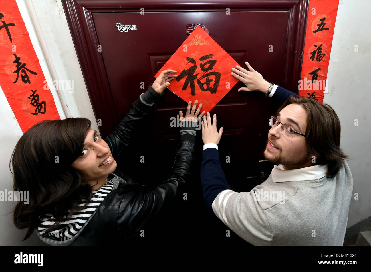 Luohe, China's Henan Province. 13th Feb, 2018. Foreign students paste a ...