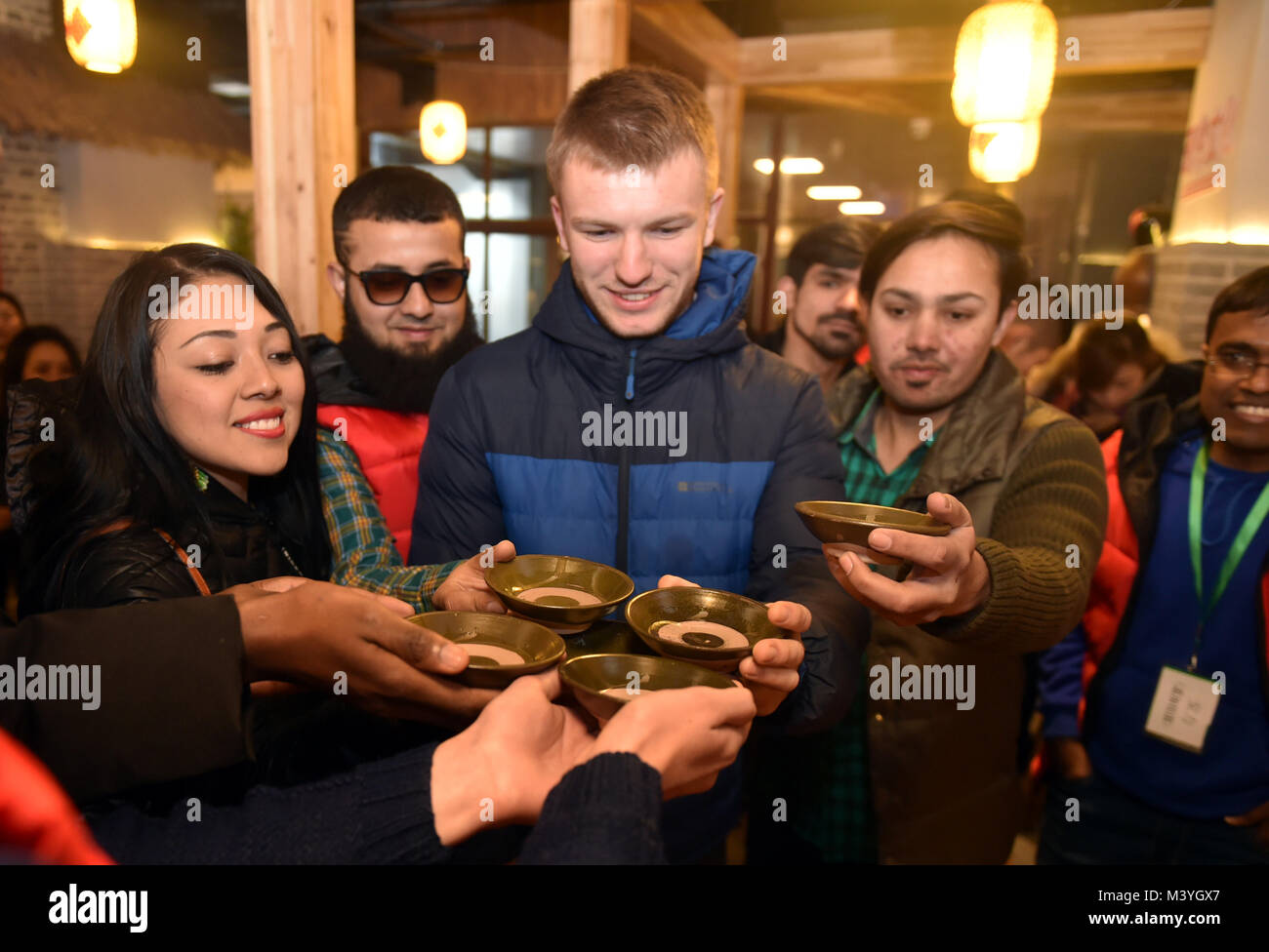 Luohe, China's Henan Province. 12th Feb, 2018. Foreign students drink ...