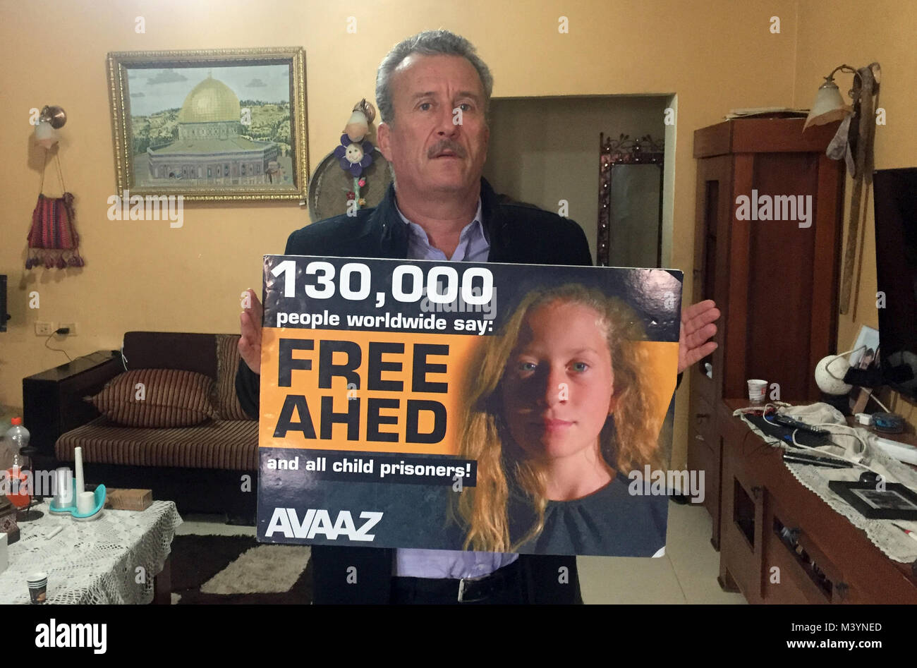 Nabi Saleh, West Bank. 28th Jan, 2018. FILED - Bassem Tamimi holds a ...