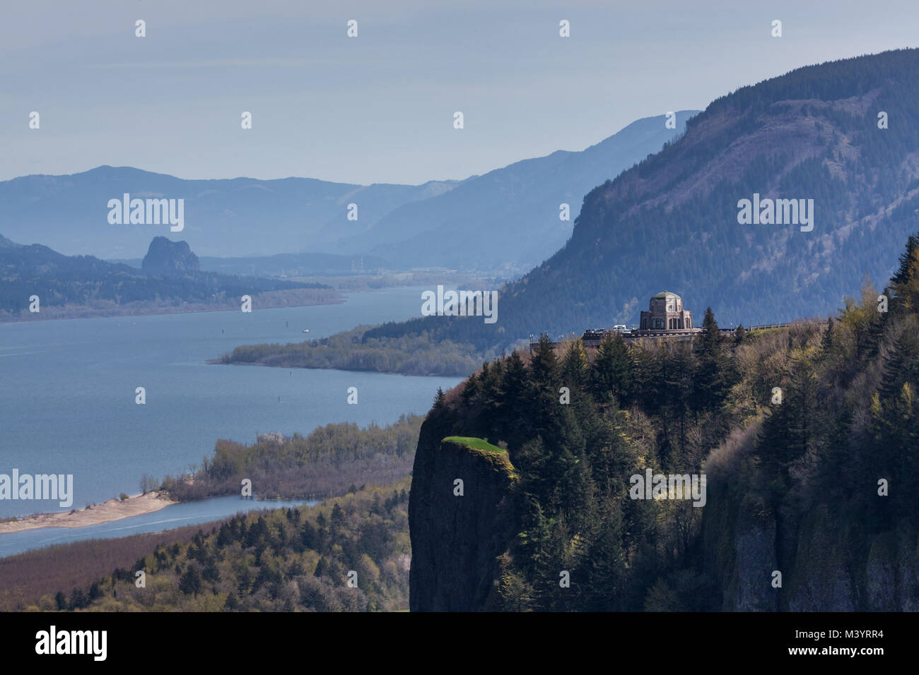 A view of the Columbia River Gorge with the Vista House on a ledge ...
