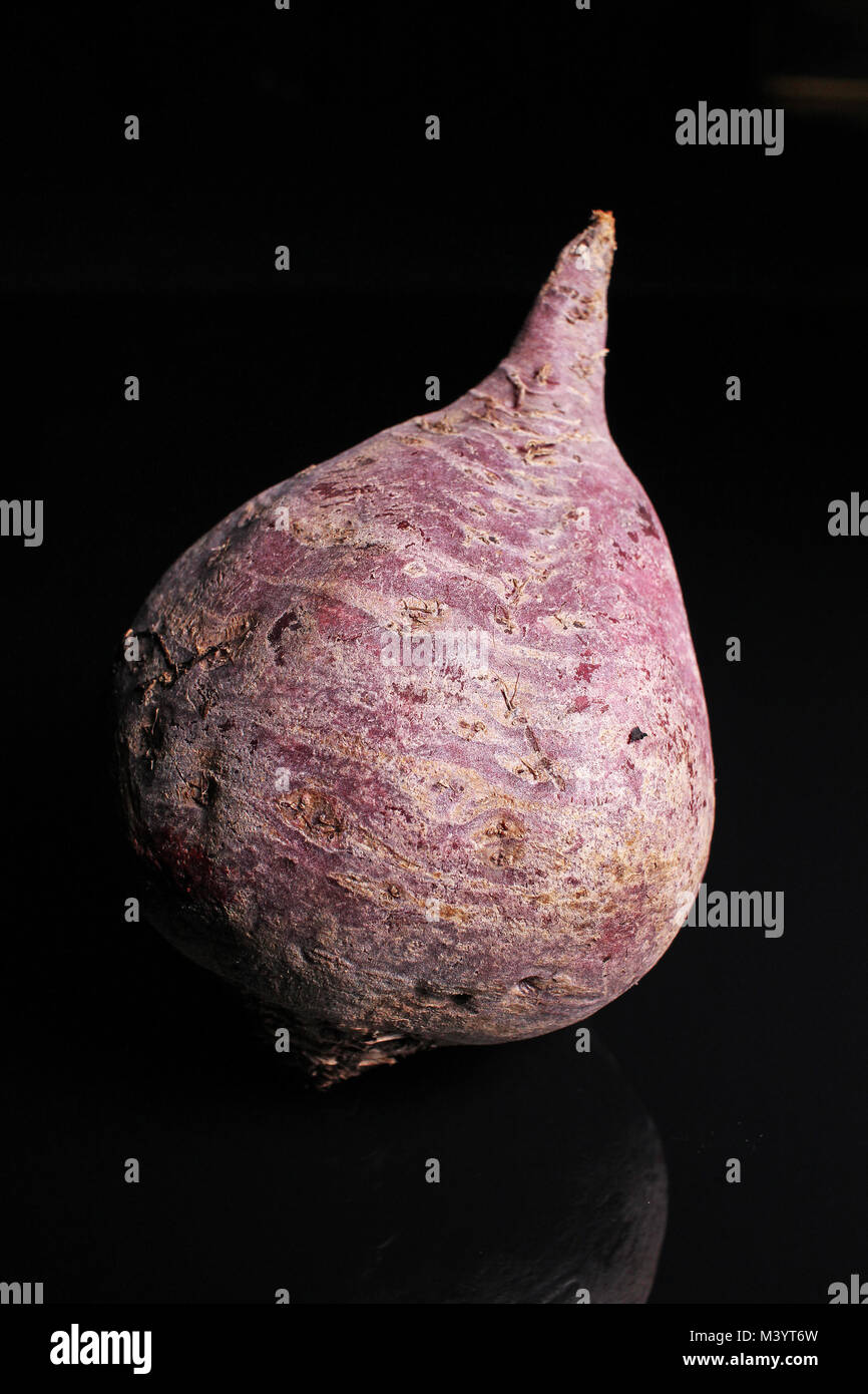 Beetroot beet on black reflective studio background. Isolated black ...
