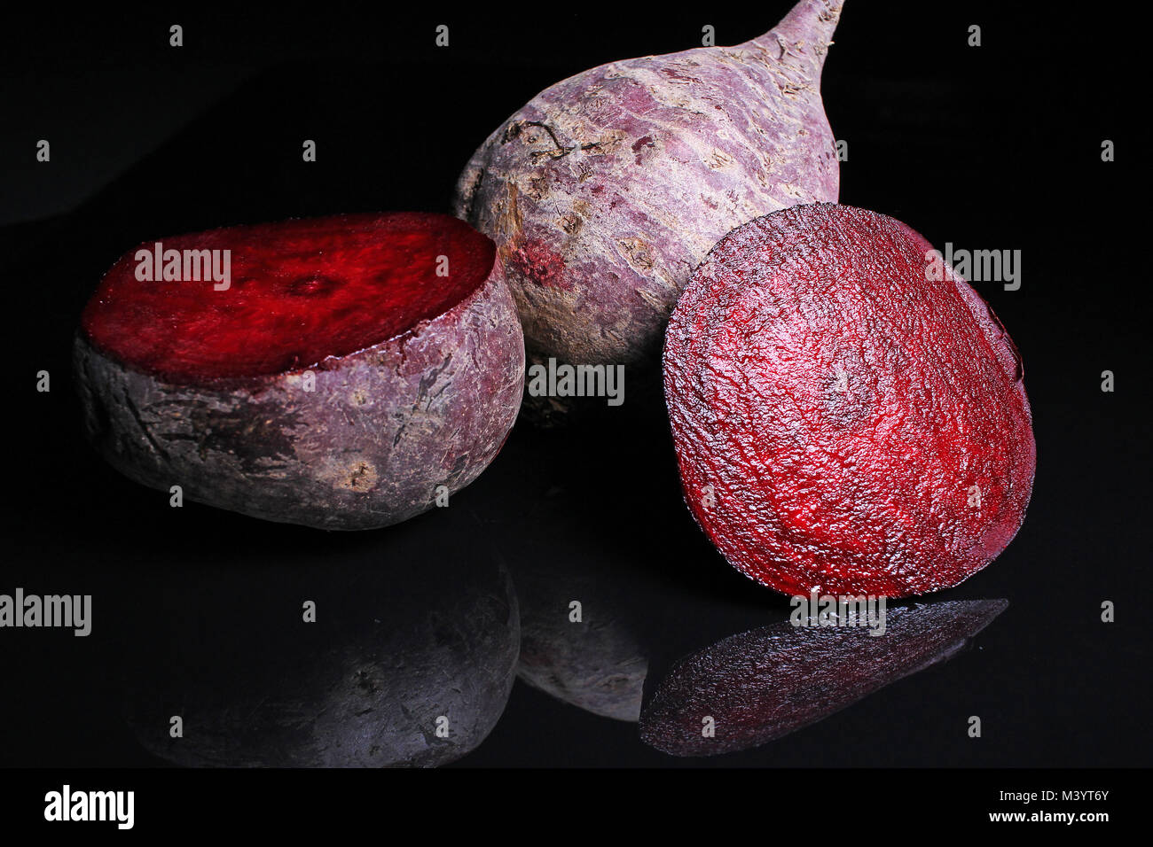Beetroot beet on black reflective studio background. Isolated black ...