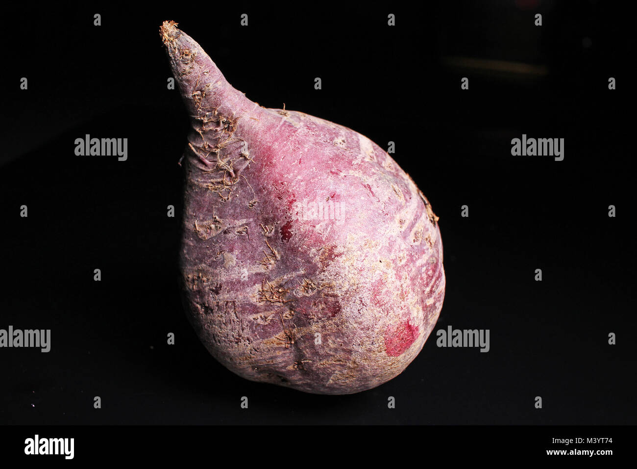 Beetroot beet on black reflective studio background. Isolated black ...