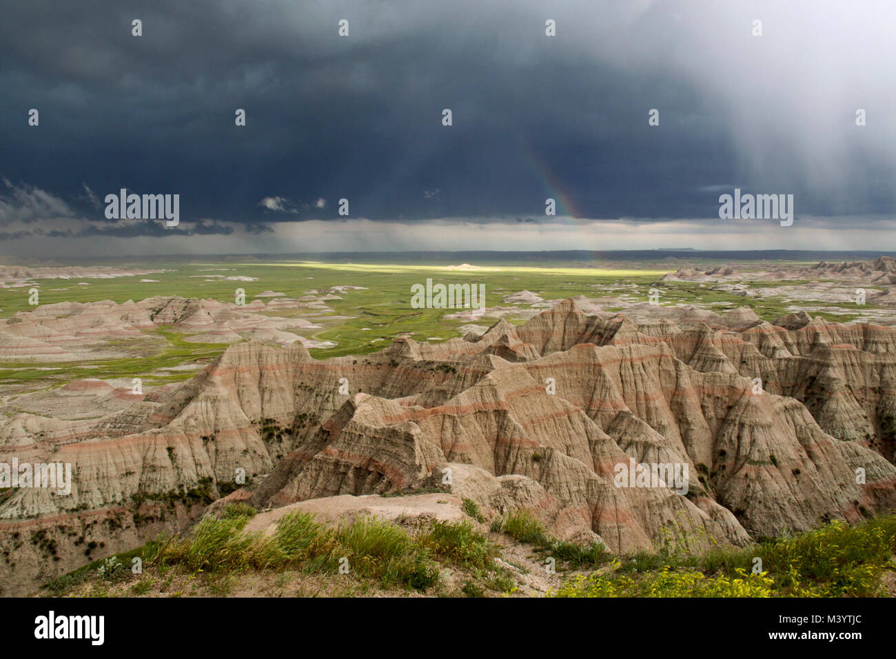 Rainbow During a Badlands Storm Stock Photo - Alamy