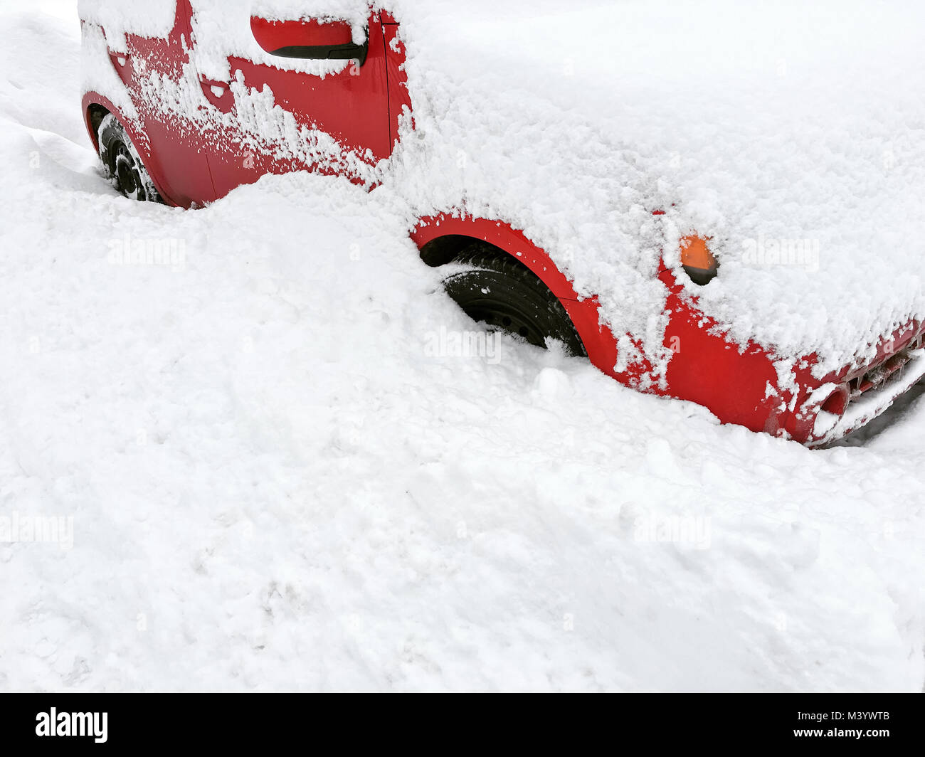 Red car in white snow. Montreal, Canada, after a snowstorm Stock Photo ...