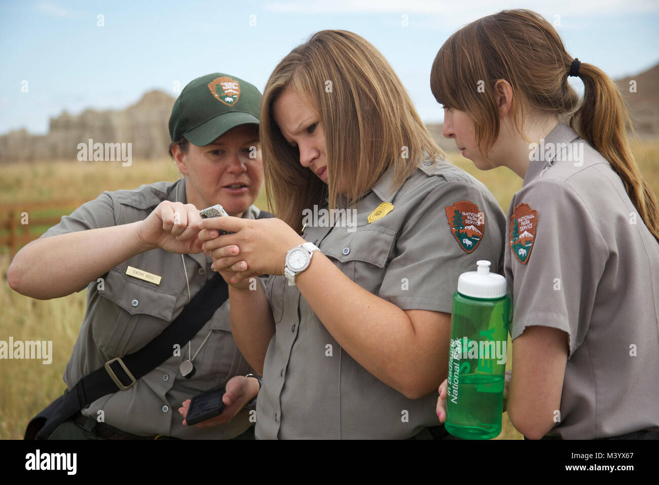 Park Ranger Cathy Bell helps Youth Interns Jennifer and Kelly as they ...