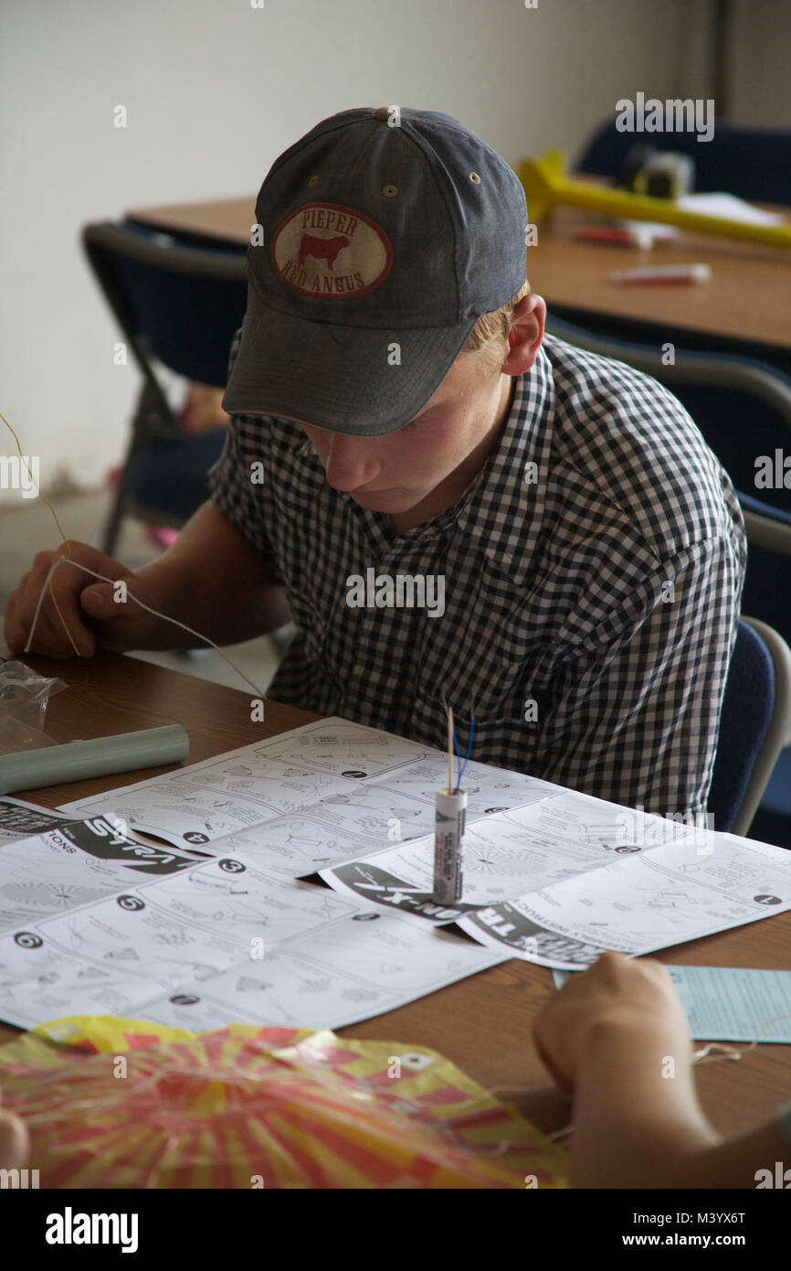 A boy gets started building his model rocket Stock Photo - Alamy